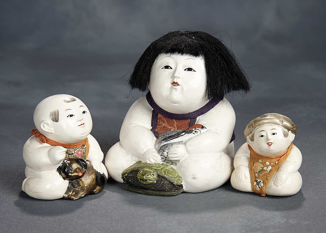 Three Japanese Kneeling Gosho-Ningyo in Graduated Size with Rare ...