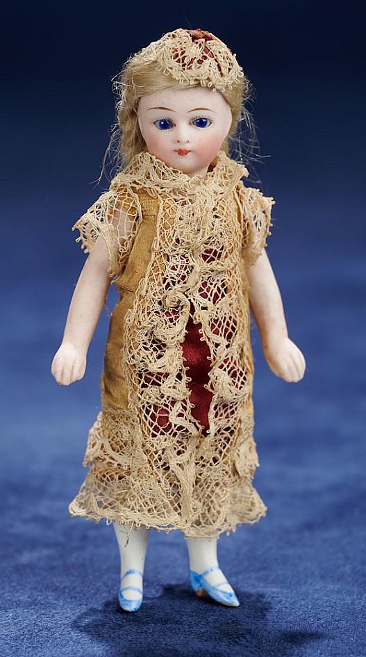 A Companion French All-Bisque Mignonette in Matching Costume