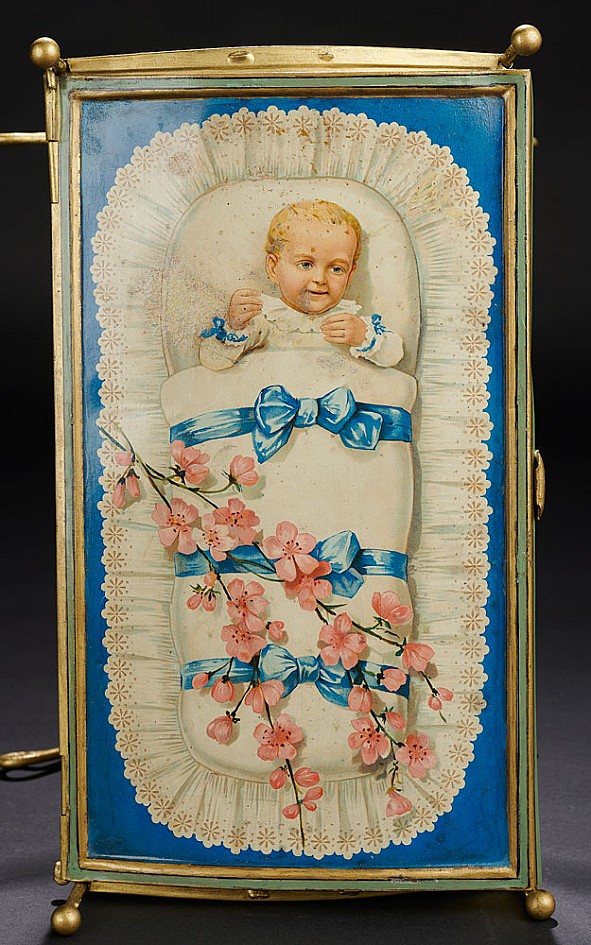 Rare German Lithographed Tinplate Candy Box in the Shape of Baby Cradle